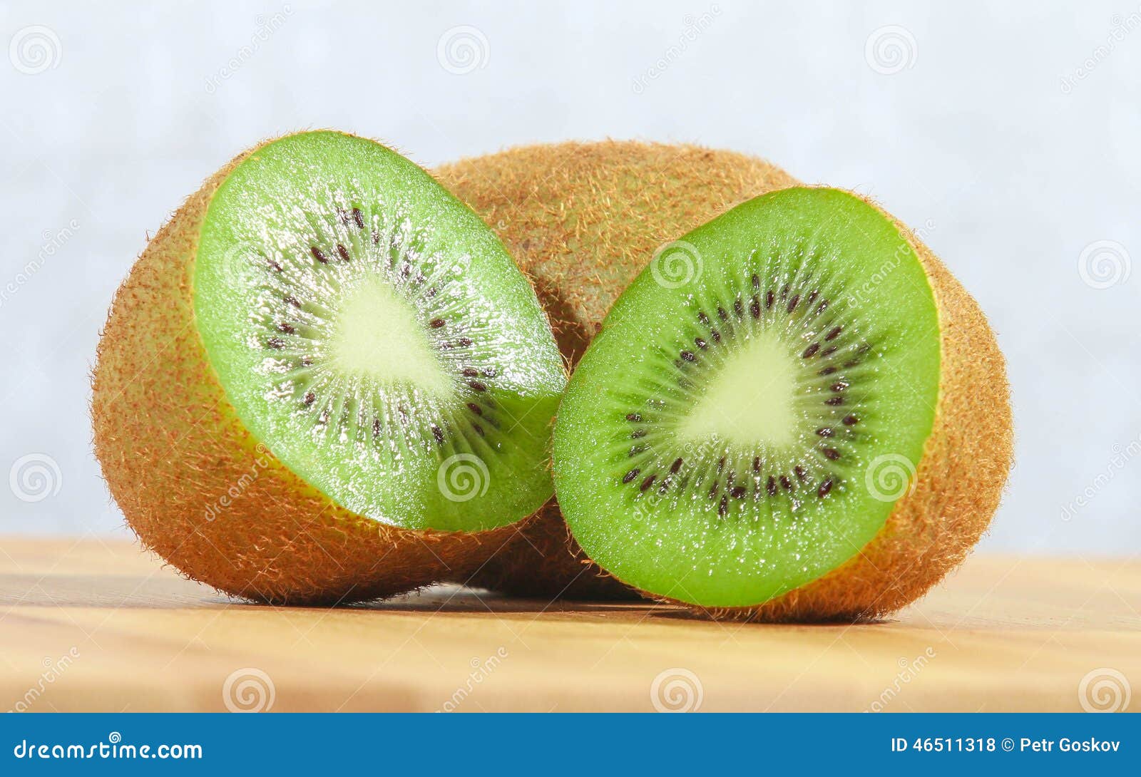Whole and half kiwi fruit stock photo. Image of tasty - 46511318