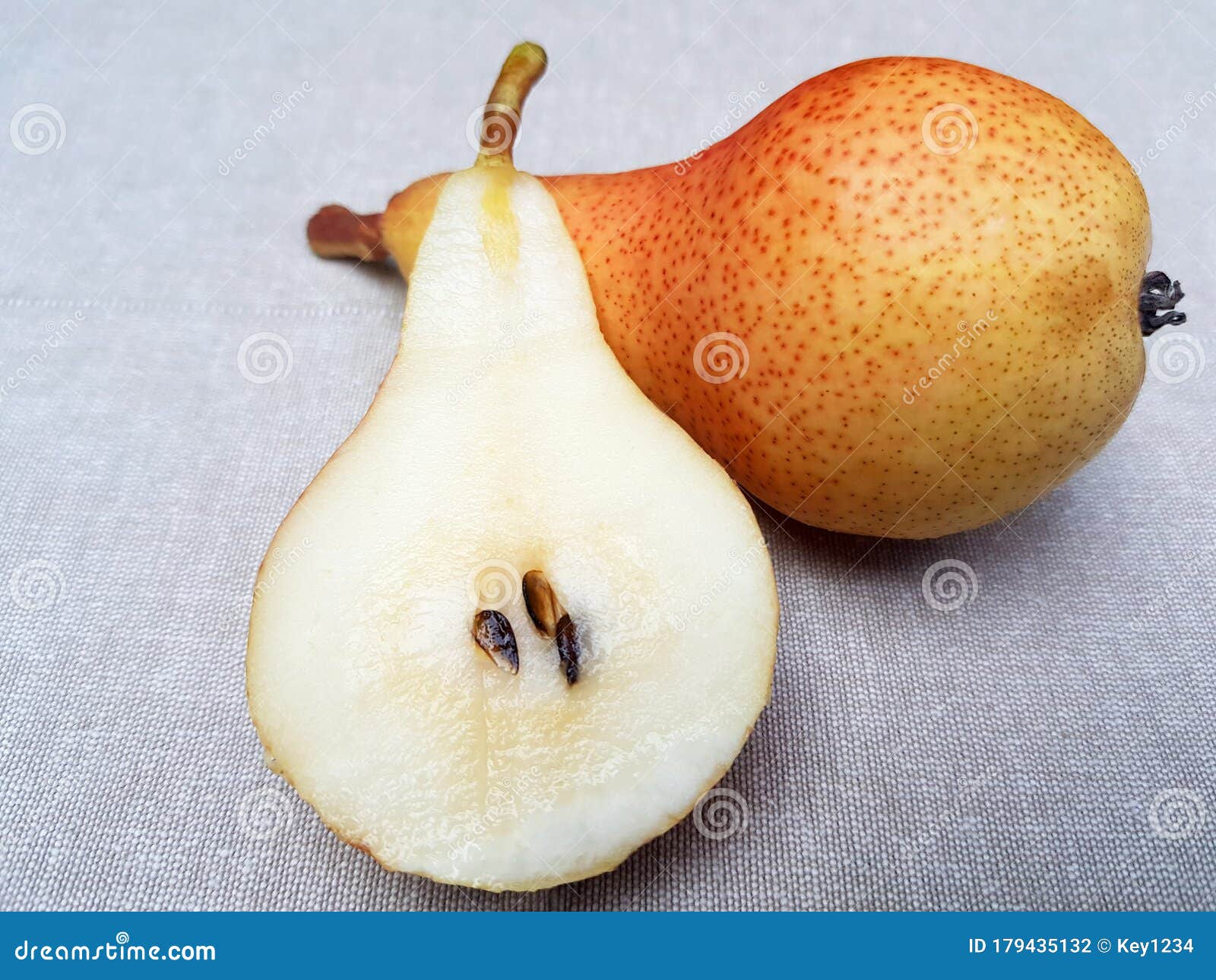 A whole and half pears stock photo. Image of dark, backdrop - 179435132