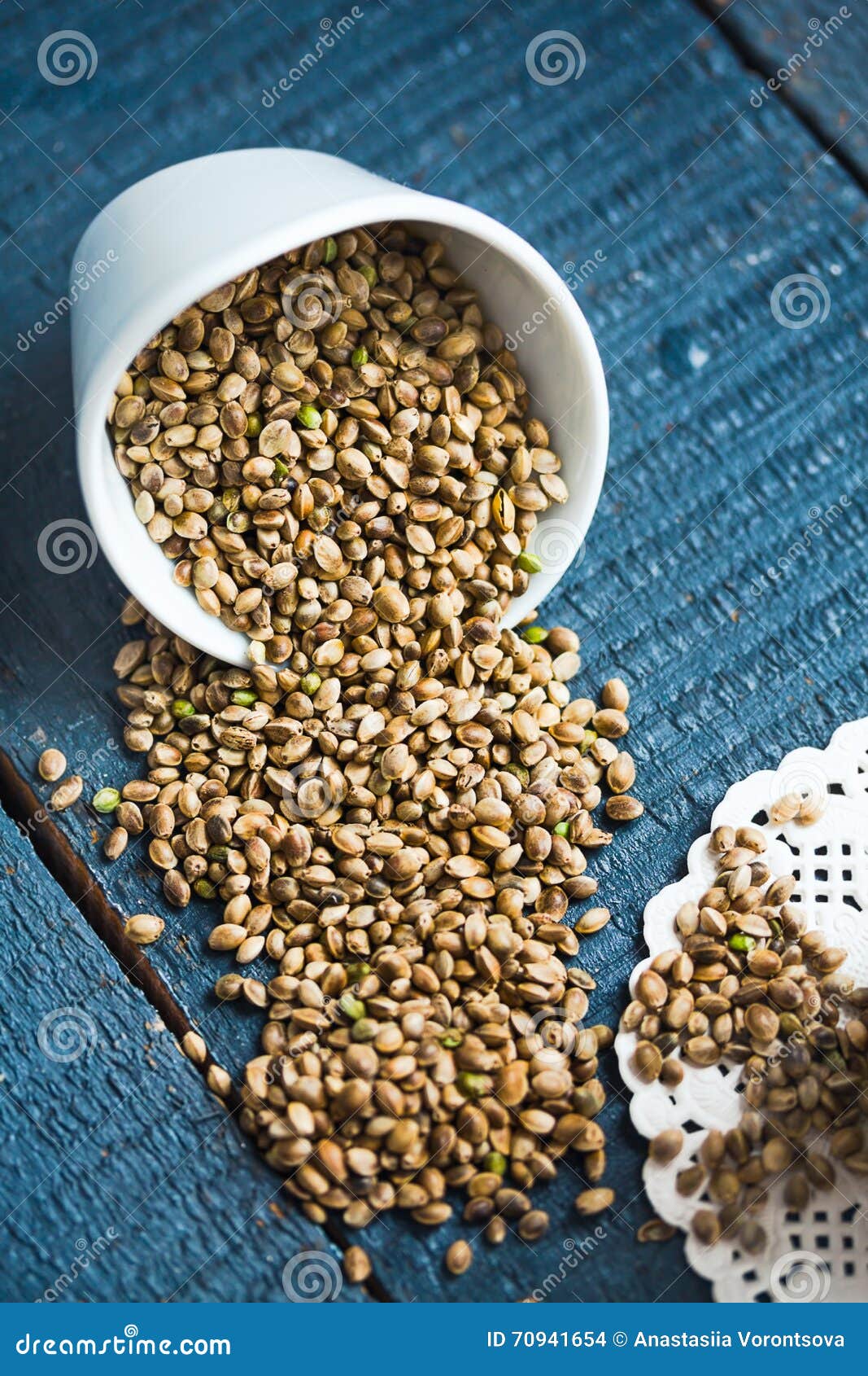 Whole Hemp Seeds in a White Bowl, Placer, Blue Background Stock Photo ...