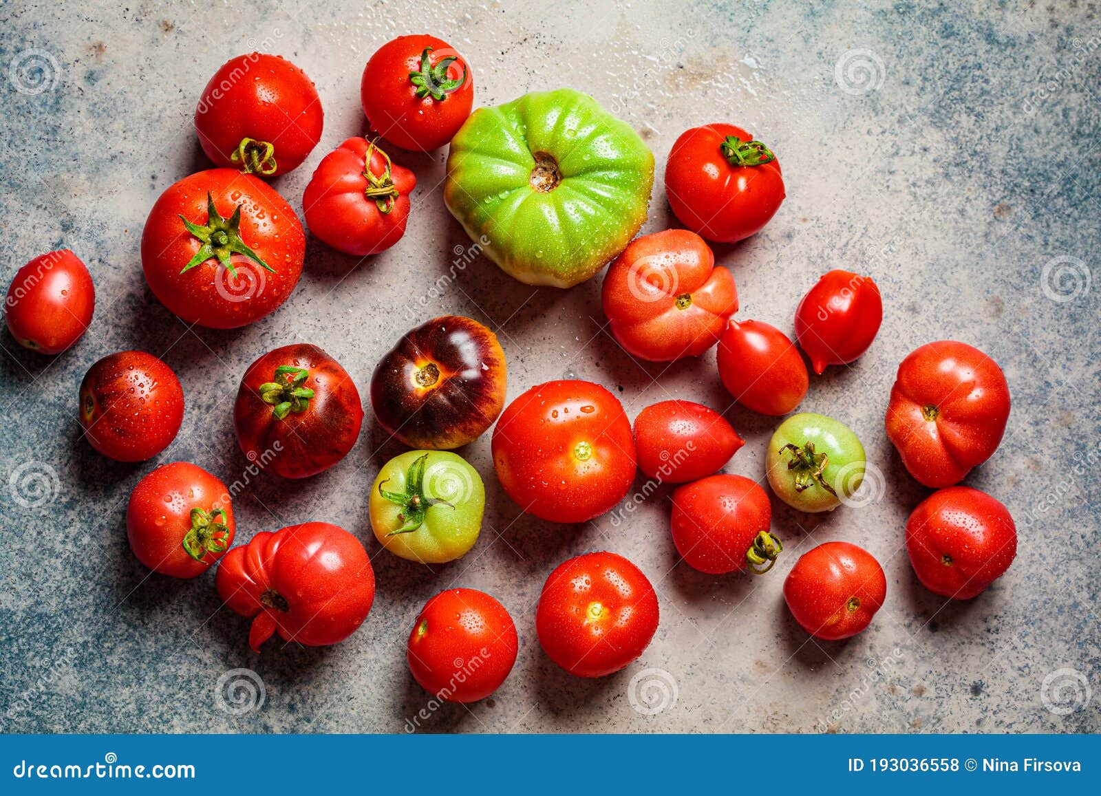 Whole Multi-colored Ripe Tomatoes on Dark Blue Background, Top View ...