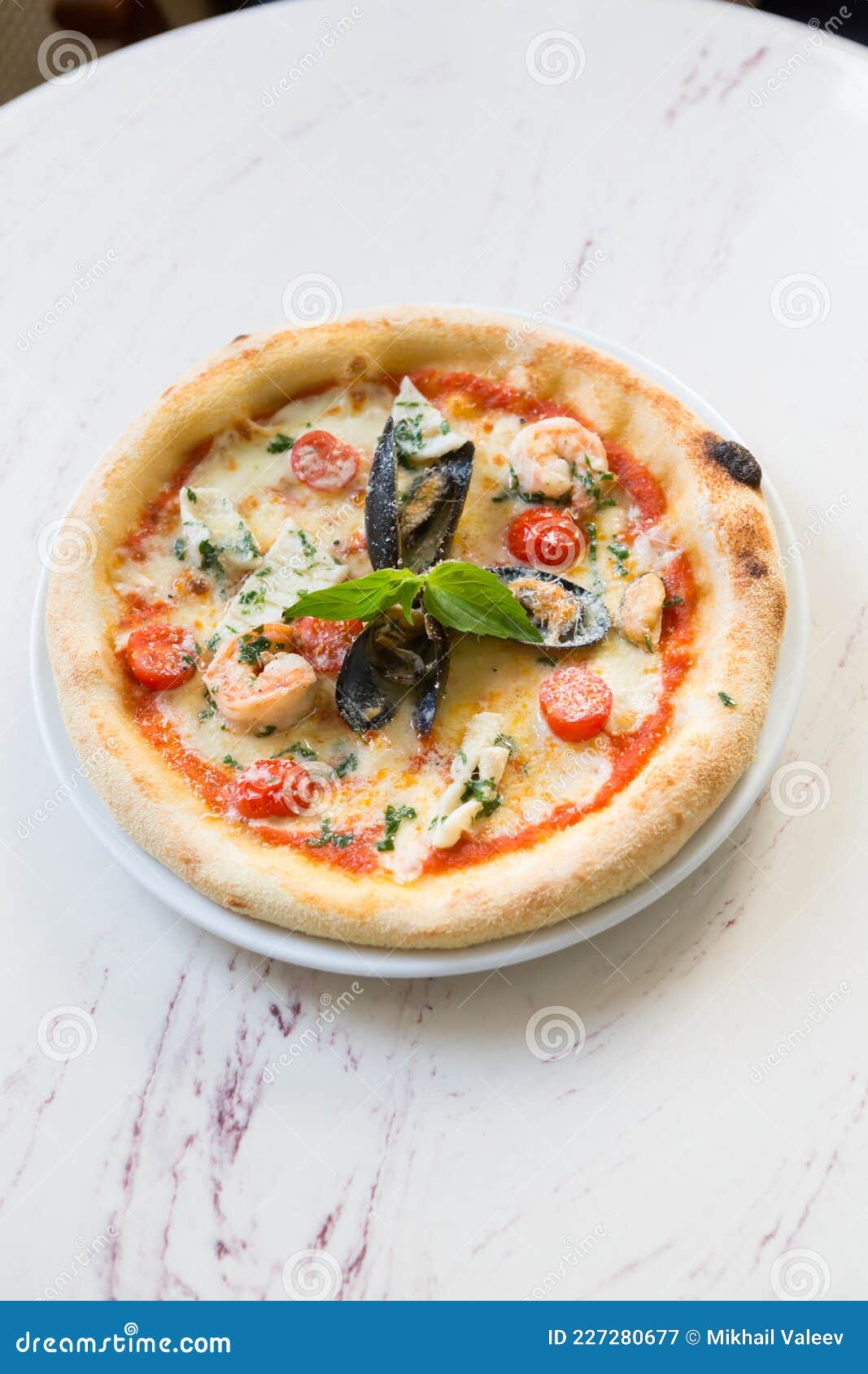 Whole Neapolitan Seafood Pizza Served on a Marble Table Stock Image ...