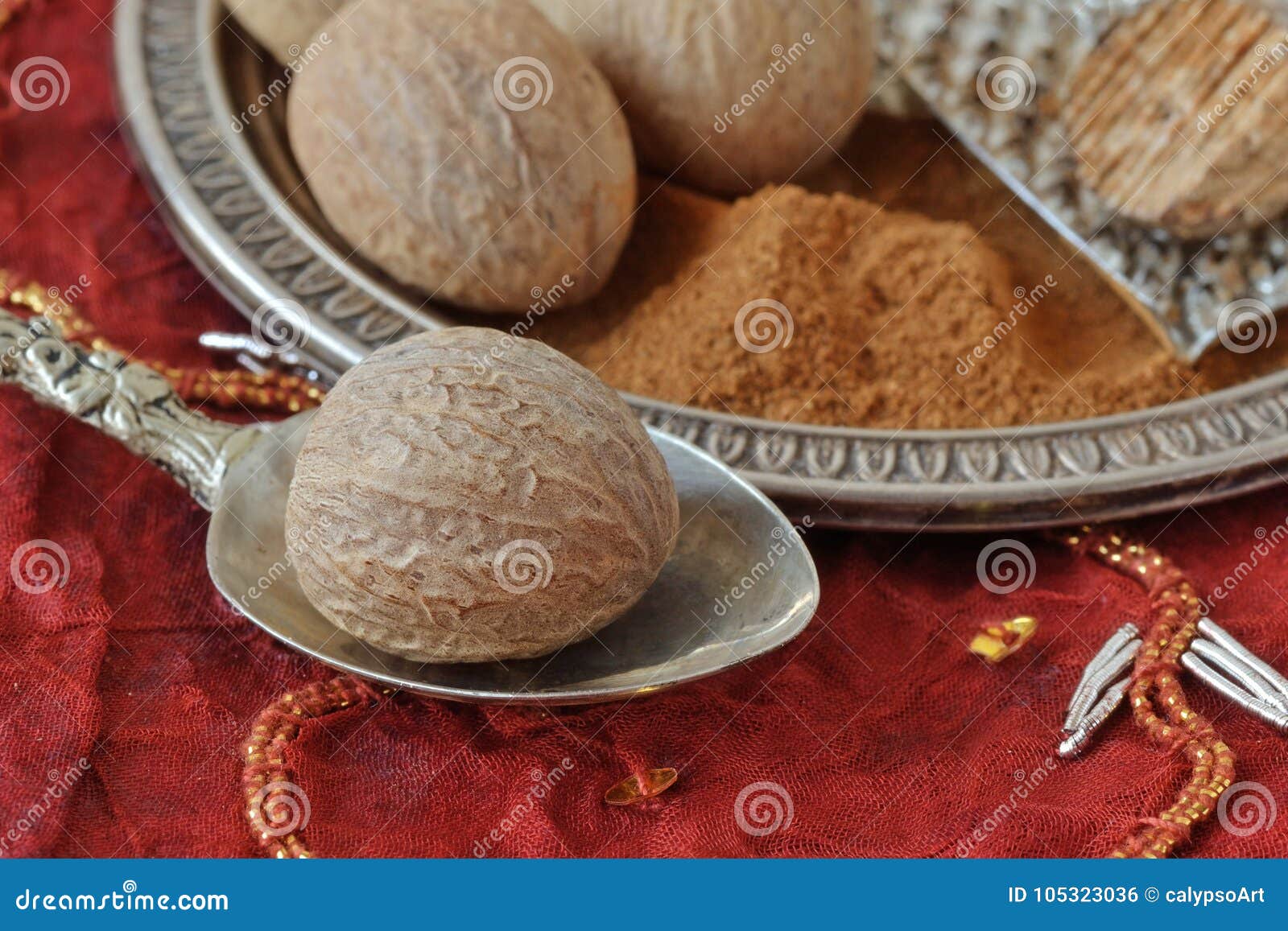 Whole Nutmeg and Nutmeg Powder on Spoon and Plate Stock Photo - Image ...