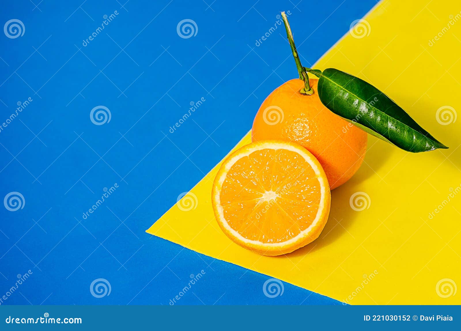A Whole Orange Split in Half Stock Photo - Image of citric, background ...