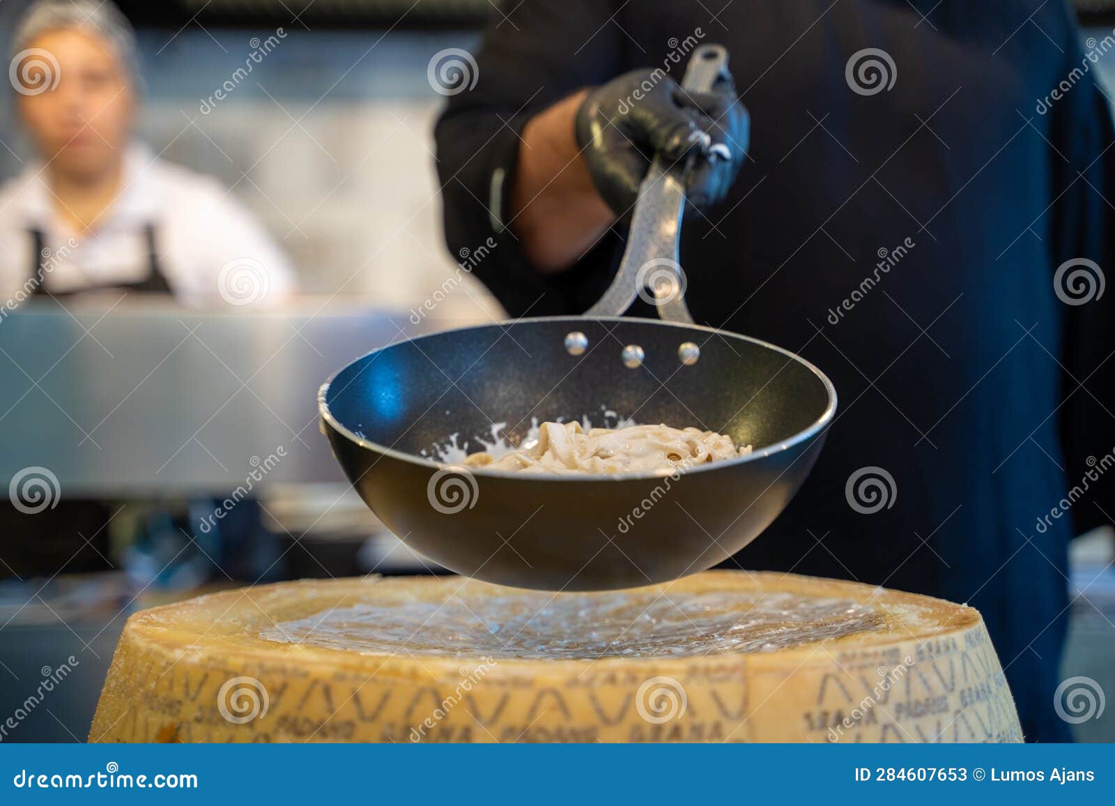 Whole Parmesan Wheel and Pasta with Sauce in the Pan Stock Image ...