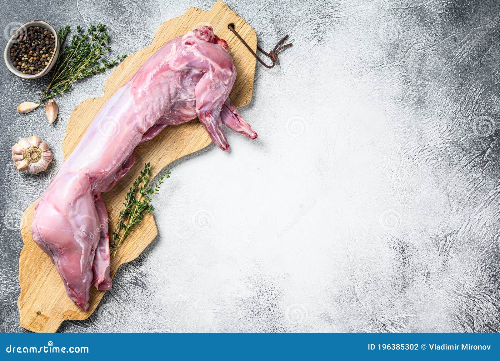 Whole Raw Rabbit on a Cutting Board. Gray Background. Top View Stock ...