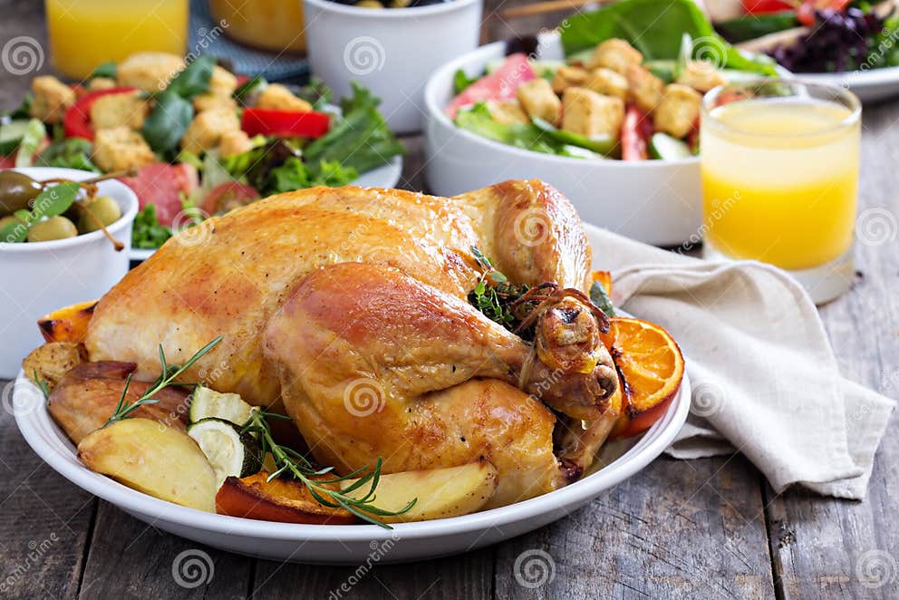 Whole Roasted Chicken on Dinner Table Stock Image - Image of parsley ...