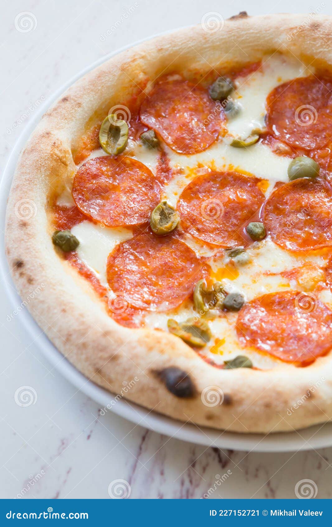 Whole Round Neapolitan Pepperoni Pizza Served on a Table Stock Image ...