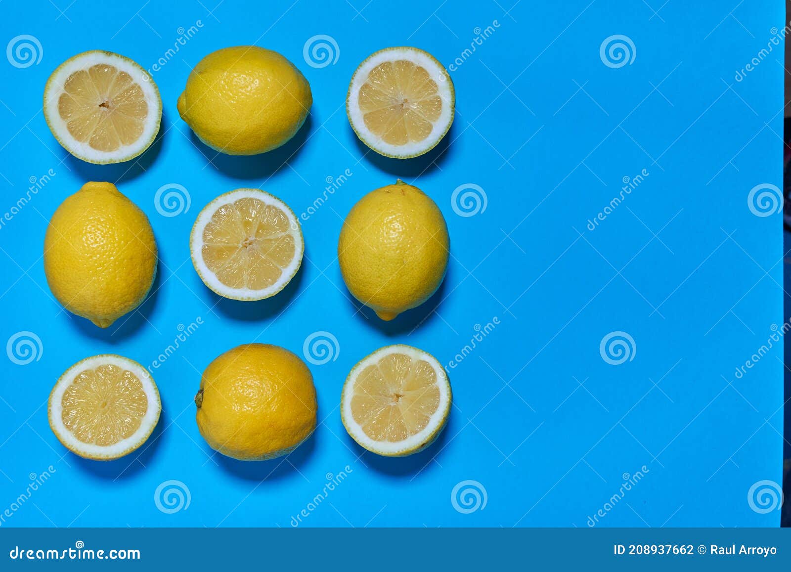 Whole and Split Lemons on a Blue Background. CITRUS CITRIC Stock Photo ...