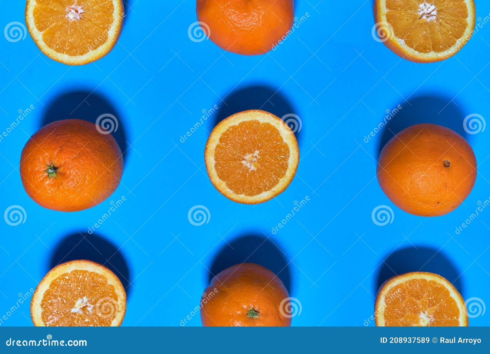 Whole and Split Oranges on a Blue Background. CITRUS CITRIC Stock Image ...