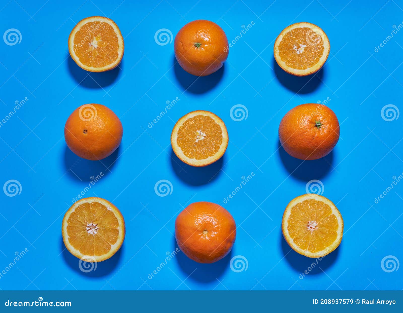 Whole and Split Oranges on a Blue Background. CITRUS CITRIC Stock Image ...