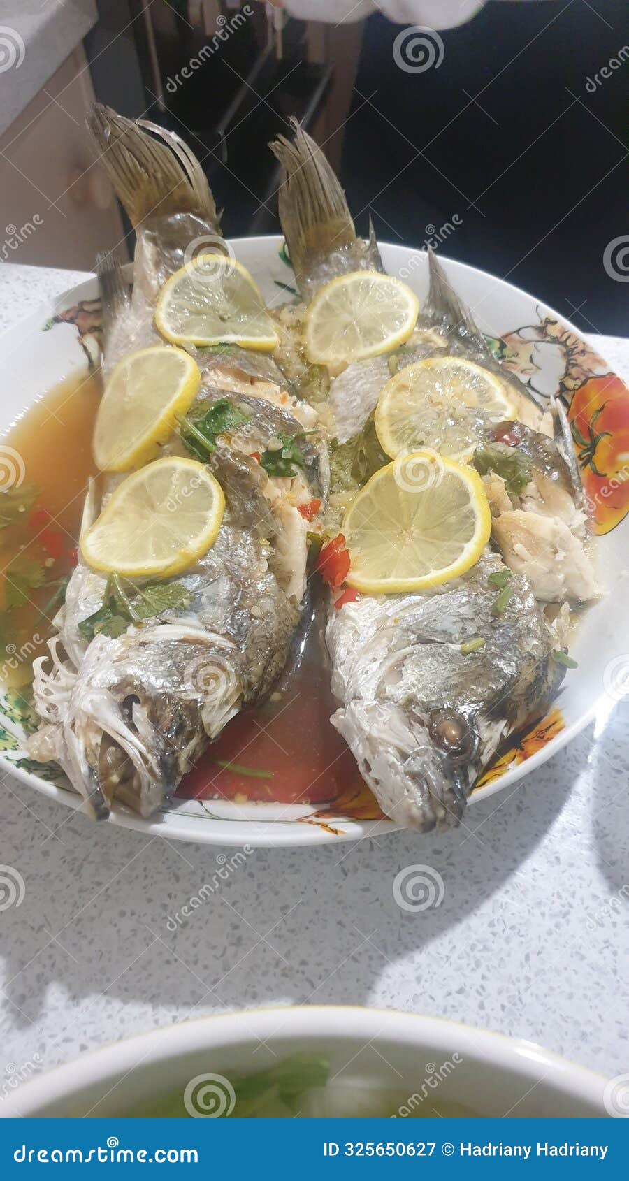 Whole Steam Fish with Lemons Stock Image - Image of lemon, fish: 325650627