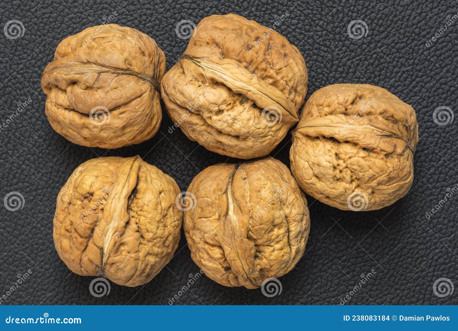 Whole Walnuts in Shell Isolated on Black Faux Leather Stock Photo ...