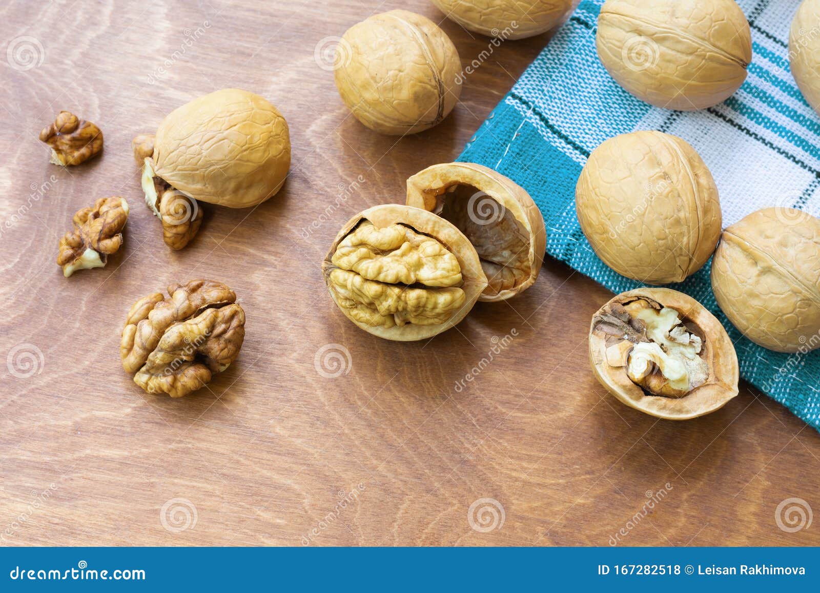 Whole Walnuts and Walnut Kernel Halves without Shell on a Dark Wooden ...