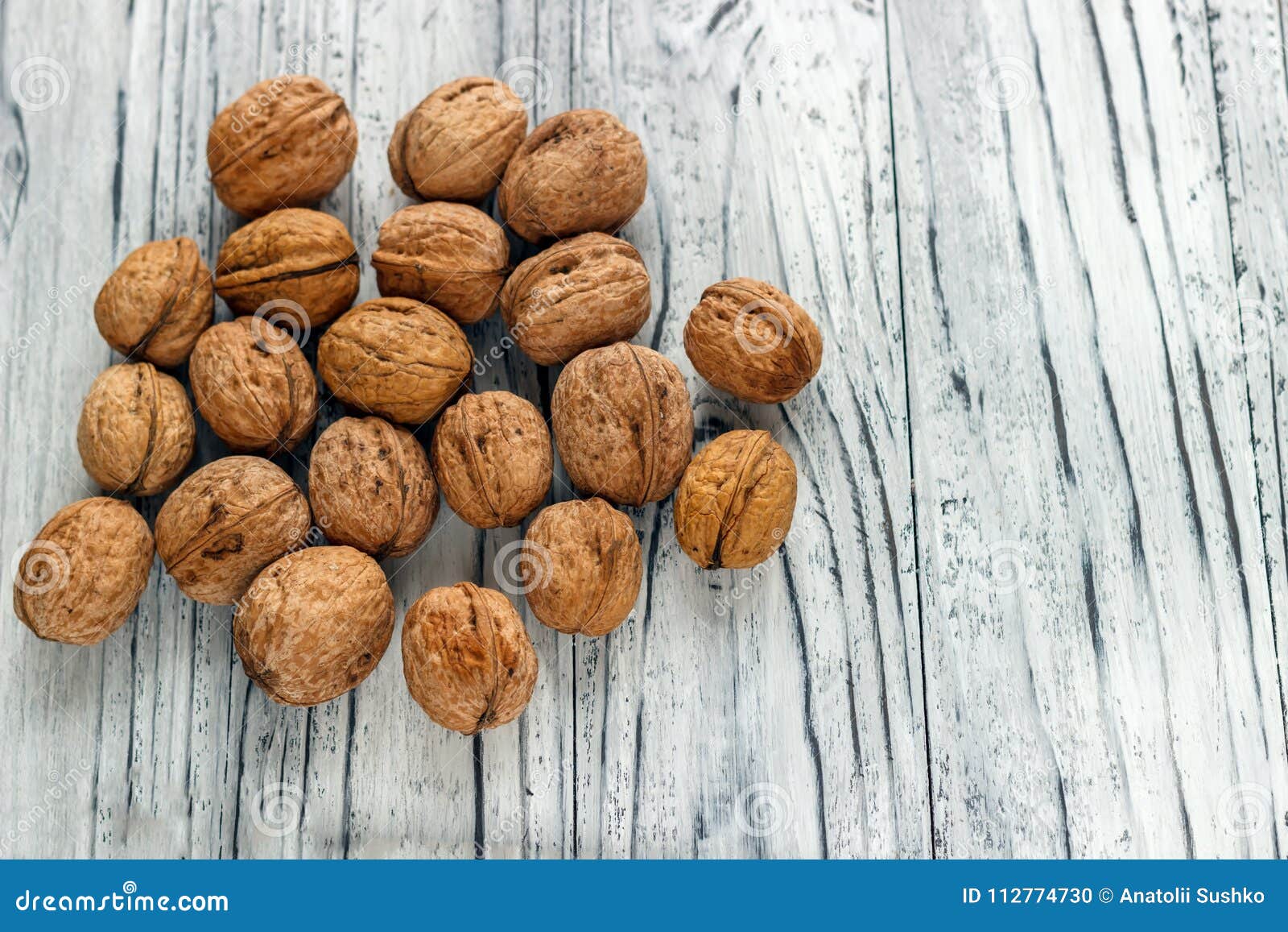 Whole Walnuts on a White Wooden Background. Stock Photo - Image of ...
