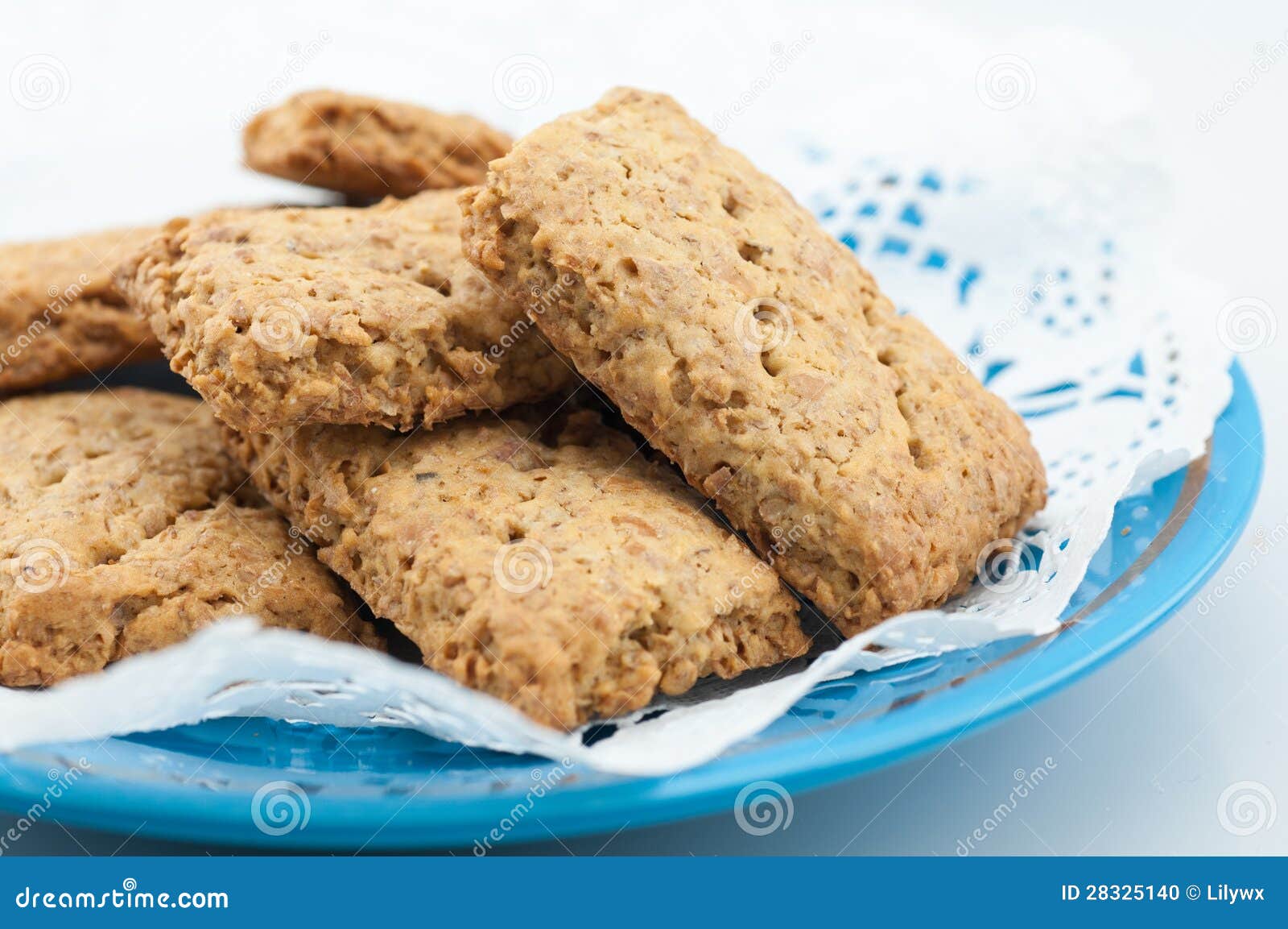 Whole wheat biscuits stock photo. Image of plate, blue - 28325140