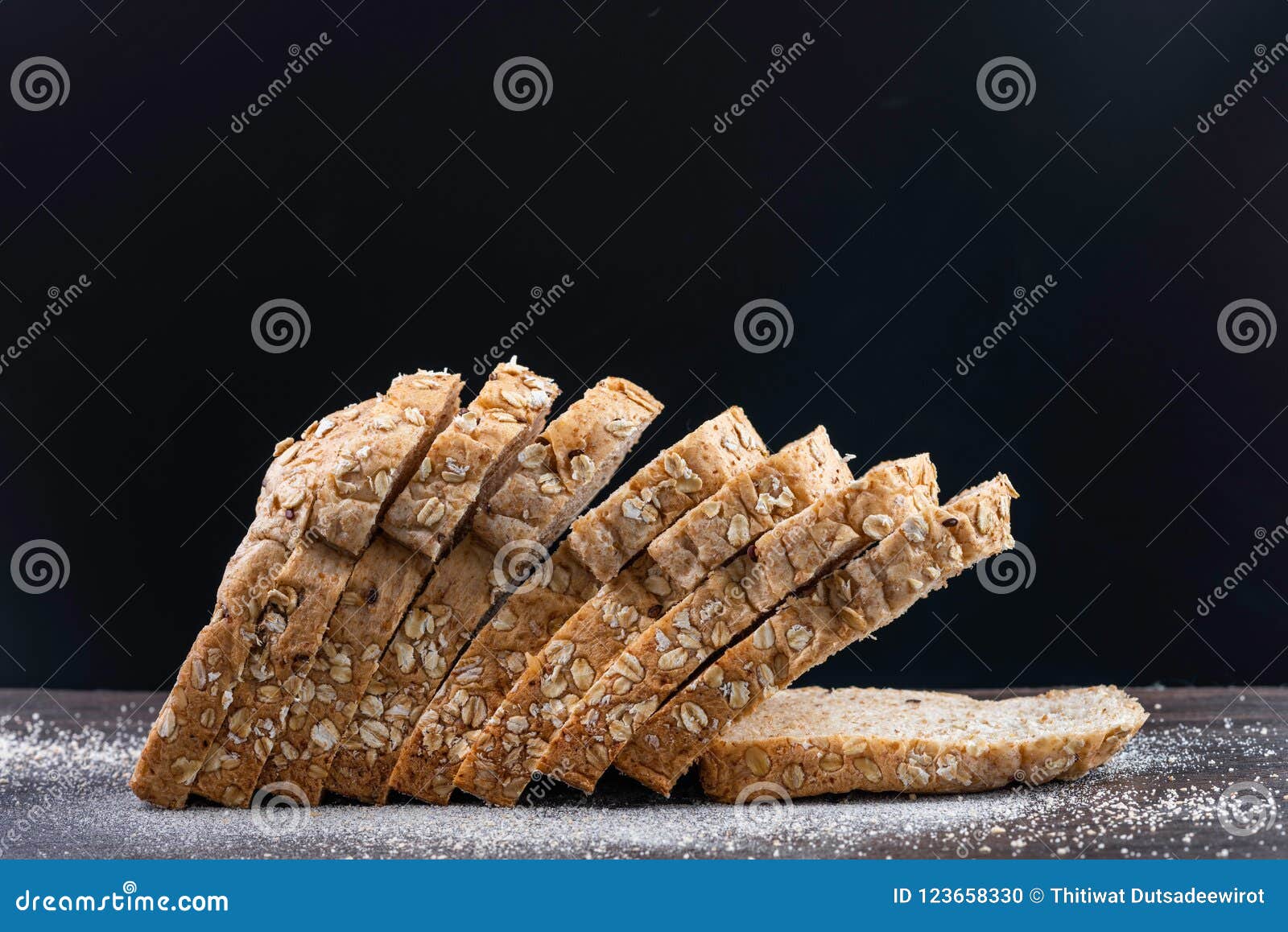 Whole wheat bread with row stock photo. Image of bakery - 123658330