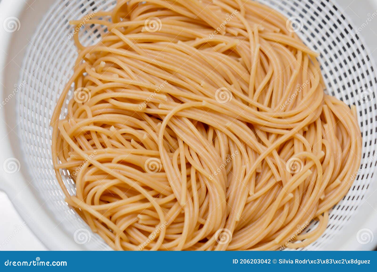 Whole Wheat Spaghetti Cooked in a Colander Stock Photo - Image of ...