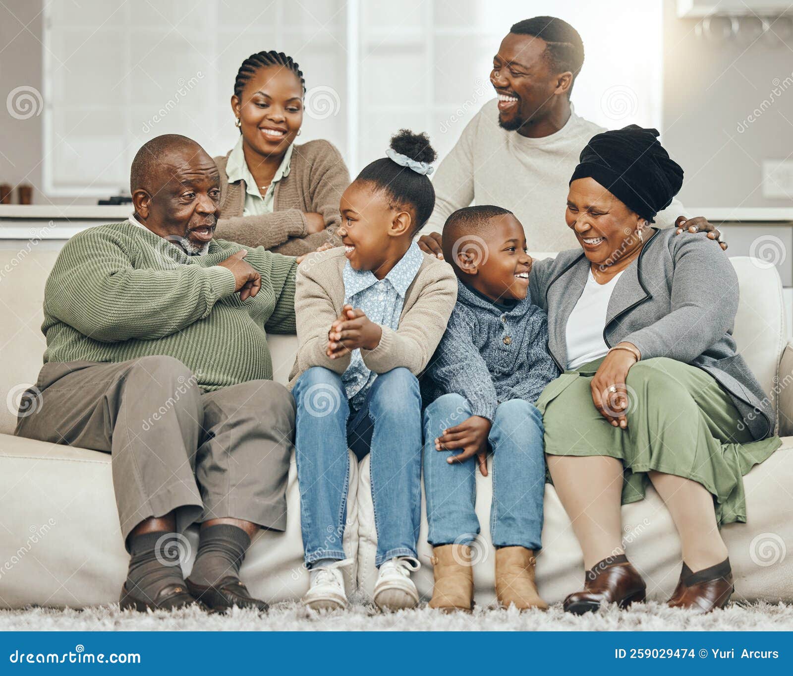 Whose Making the Tea. a Family Bonding on a Sofa at Home. Stock Photo ...