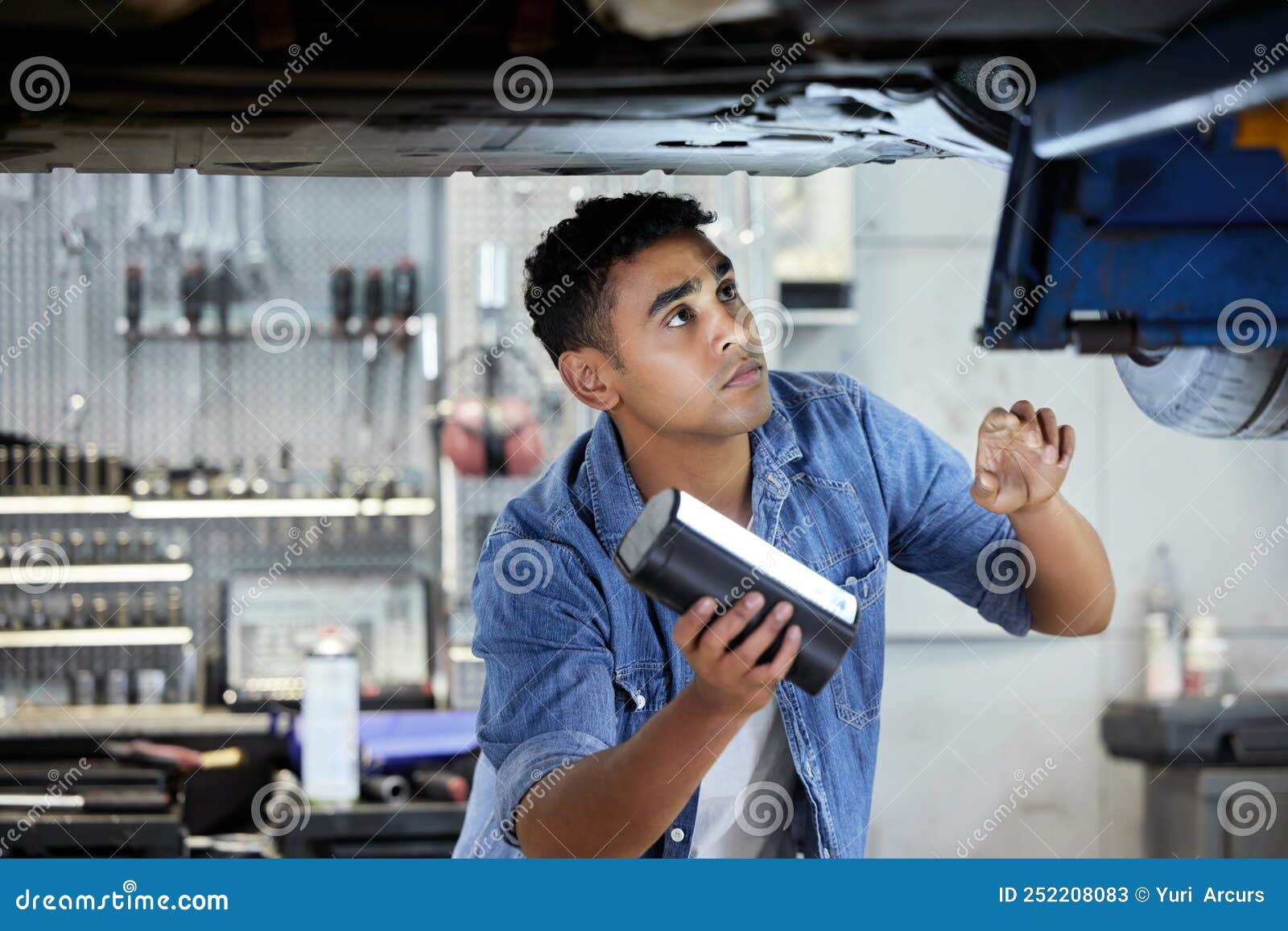 Why is this Here. a Handsome Young Male Mechanic Working on the Engine ...