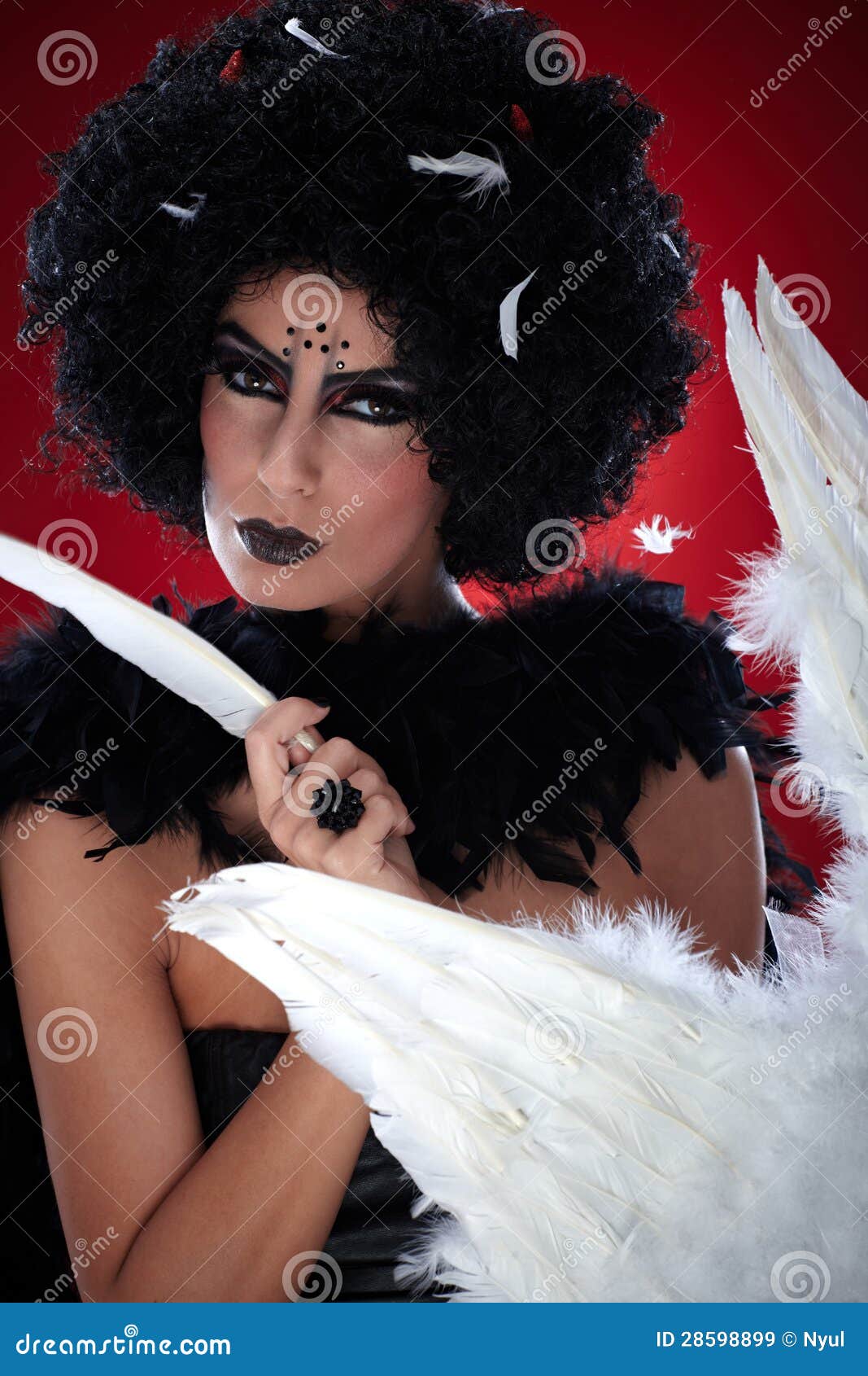 Wicked Woman Pulling Angel Feathers Stock Image - Image of bogy, face ...