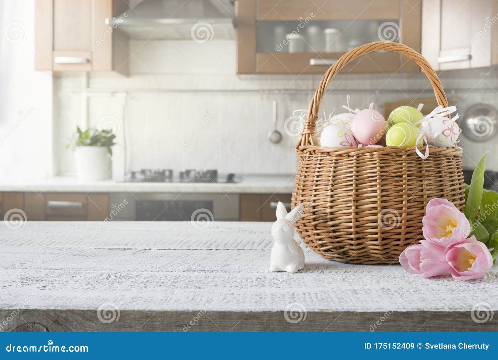 Wicker Basket with Bunny, Tulip, Easter Colorful Eggs on Kitchen Wooden ...