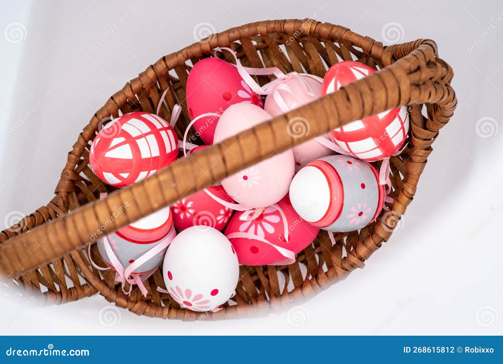 Wicker Basket with Colored Easter Eggs, on a White Background Stock ...