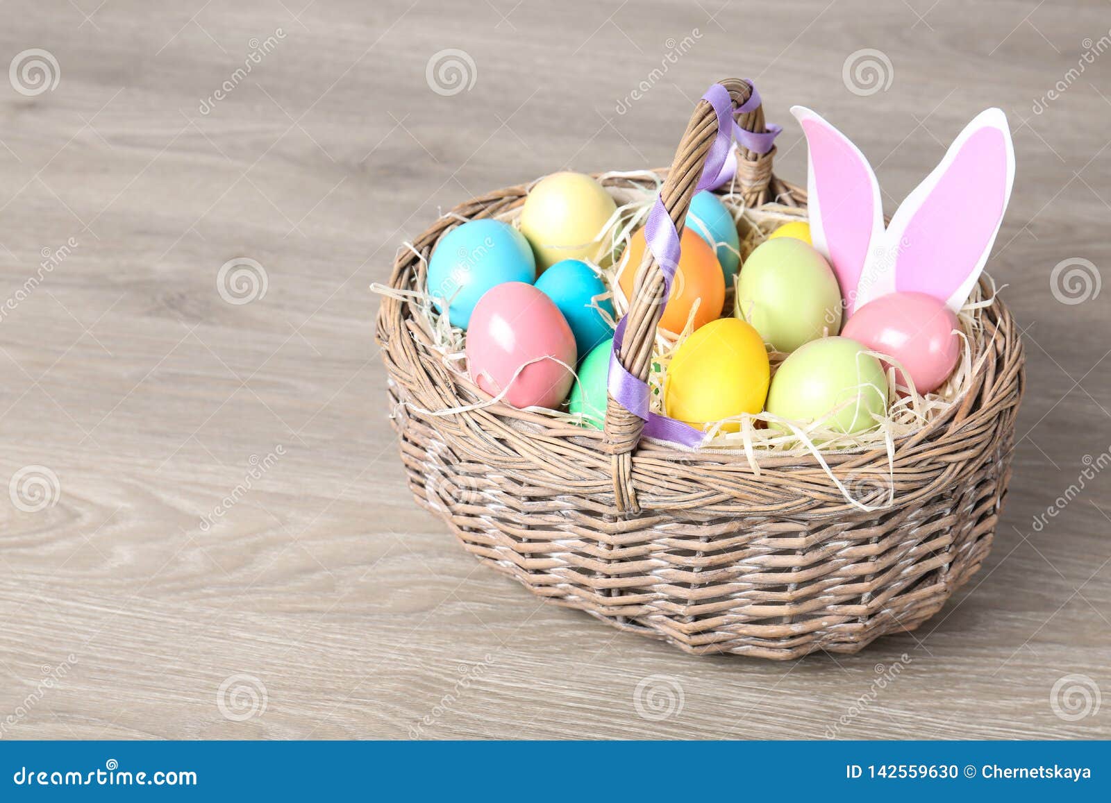 Wicker Basket with Easter Eggs and Funny Bunny Ears Stock Photo - Image ...