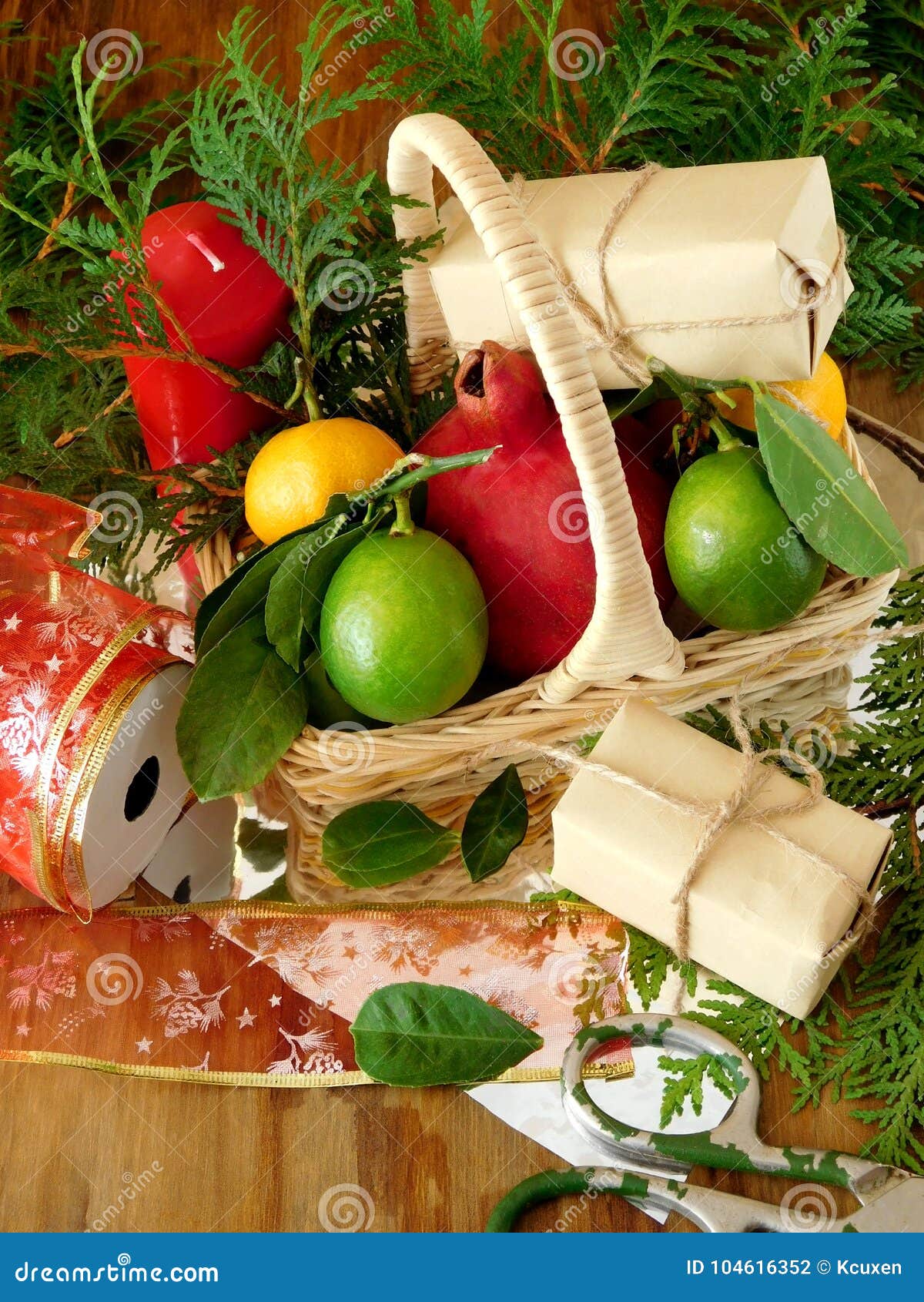A Wicker Basket Filled with Fruits Surrounded by Present Boxes and ...