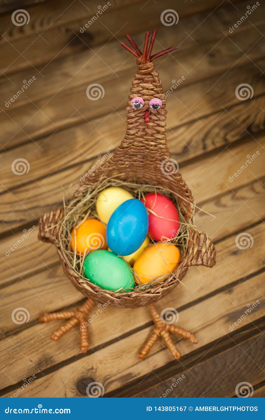 Wicker Basket in the Form of a Chicken with Colored Easter Eggs Stock ...