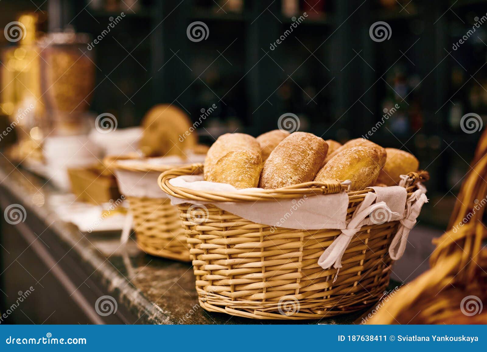 A Wicker Basket with Fresh Bread is on the Table. Pastries for ...