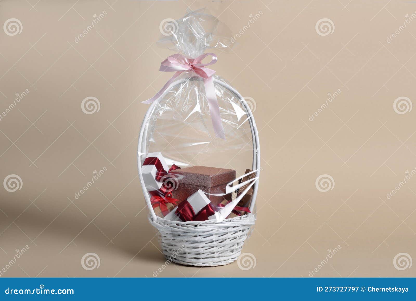 Wicker Basket Full of Gift Boxes on Beige Stock Image - Image of bright ...