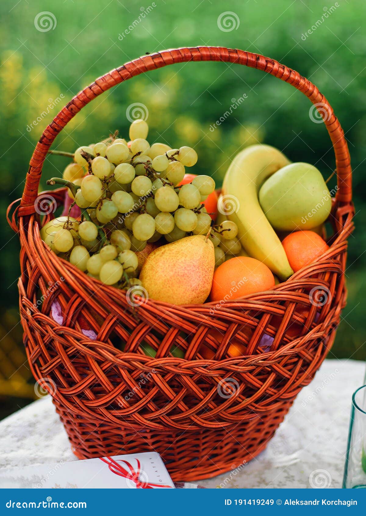 Wicker Fruit Basket with Apples, Grapes, Bananas and Pears Stock Image ...