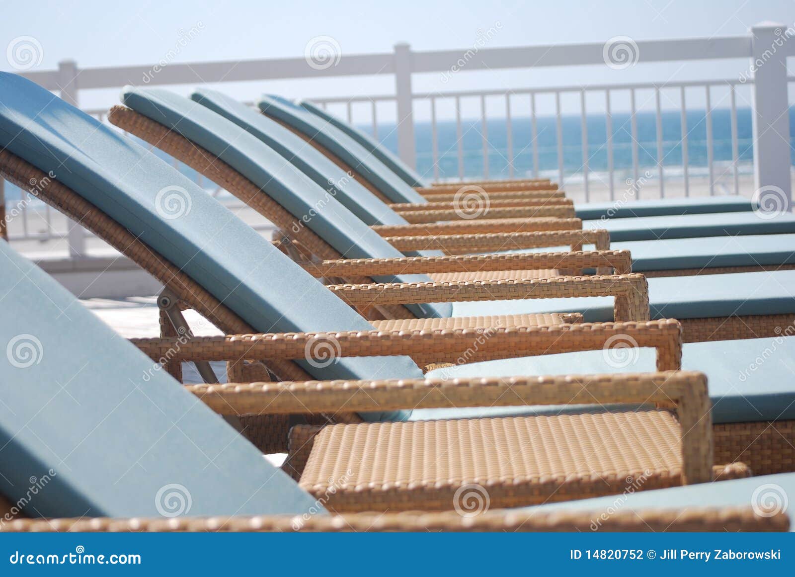 Wicker Lounge Chairs Poolside by the Beach Stock Photo - Image of ...