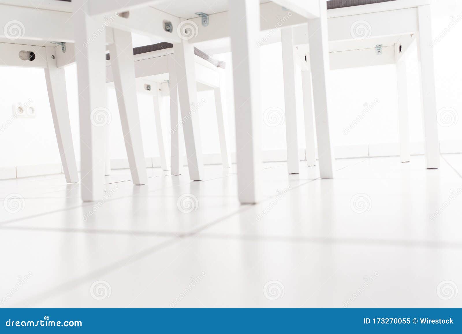 Wide Angle Shot of the Bottom Part of White Chairs Stock Image - Image ...