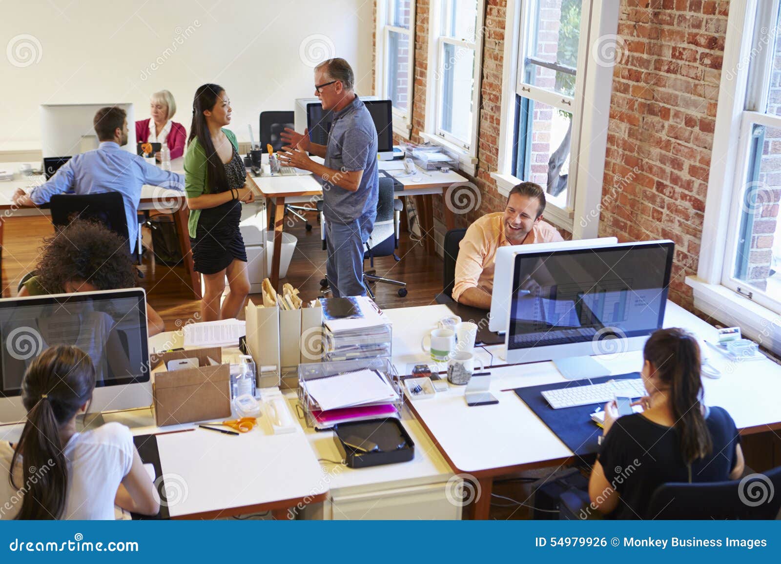 Wide Angle View of Busy Design Office with Workers at Desks Stock Photo ...