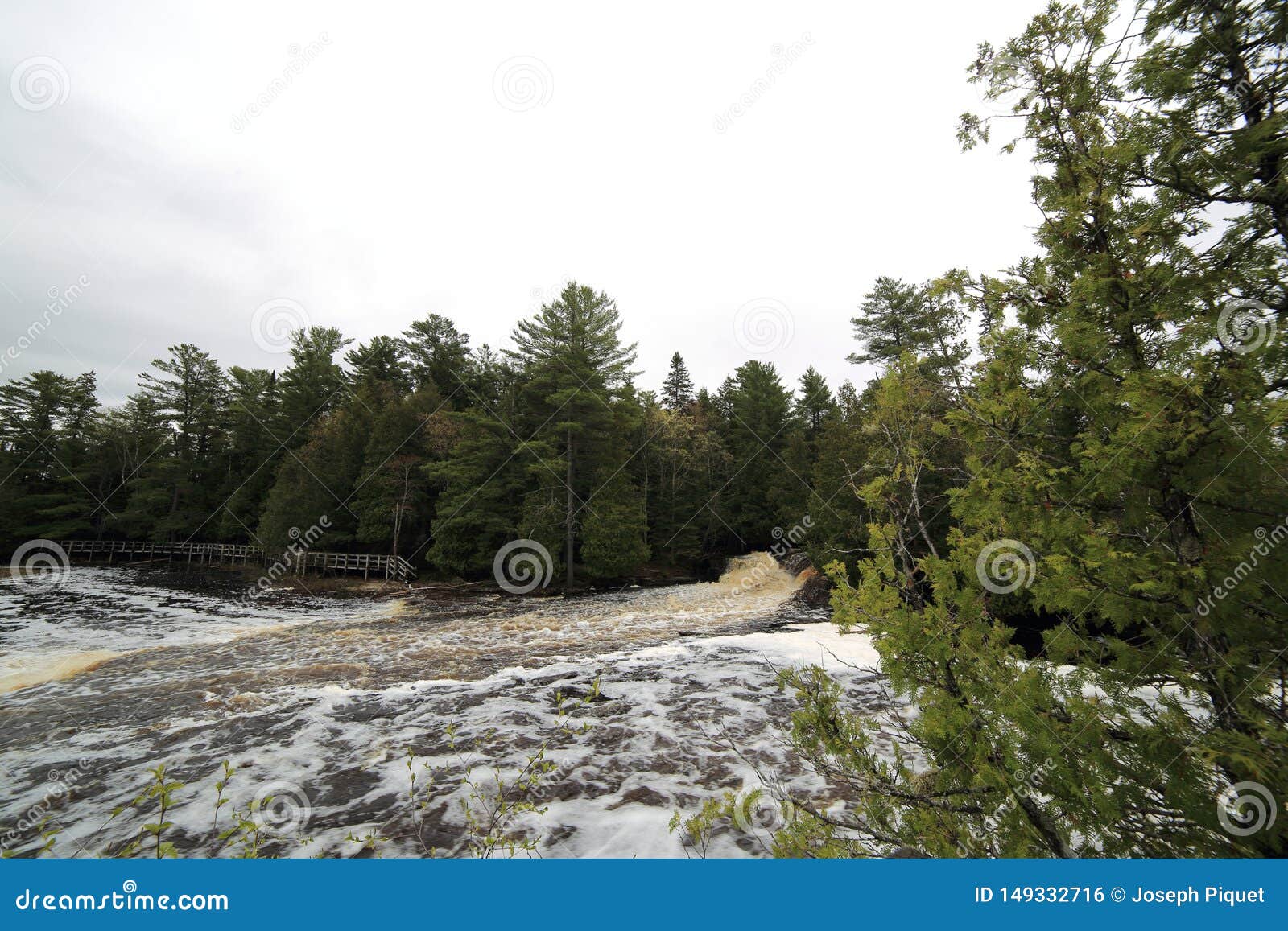 Distant Waterfall stock photo. Image of powerful, cloudy - 149332716