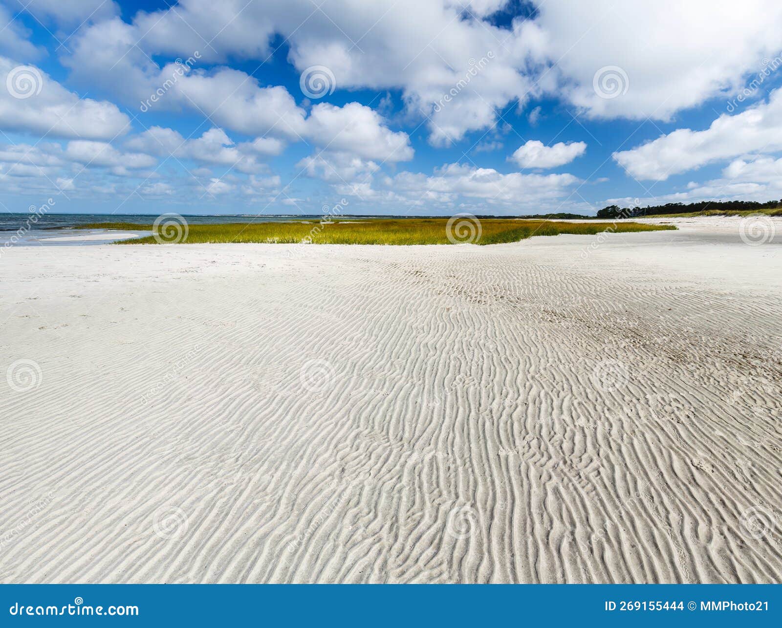 Wide Angle View of Sandbar with Sea Grass, Dunes, and Blue Sky and ...