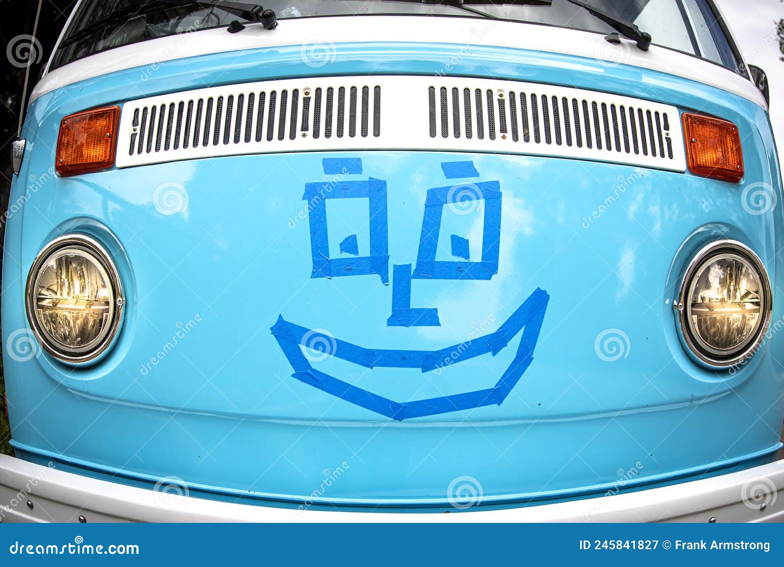 Wide Angle View of Vintage Powder Blue Bus with a Smiley Face on the ...