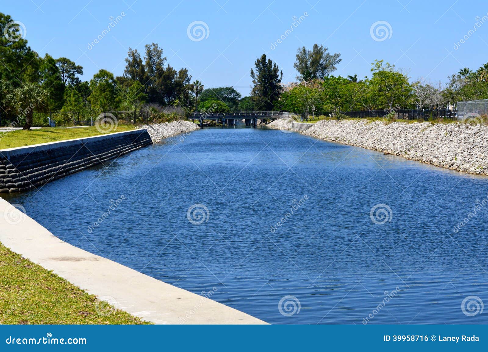Wide Canal Rocks and Blue Water Stock Photo - Image of rocks, mound ...
