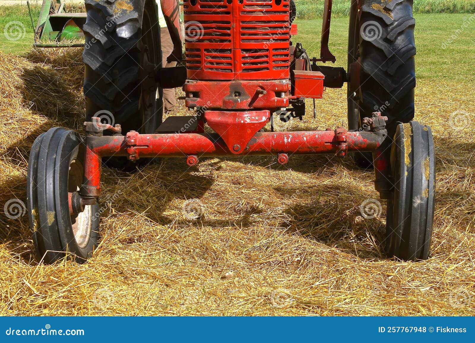 Wide Front Wheeled Red Tractor Pulling a Baler Stock Photo - Image of ...
