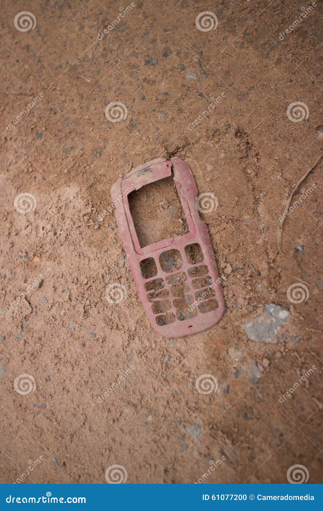 Wide Overhead View of Dusty Broken Older Style Mobile Phone Face on the ...