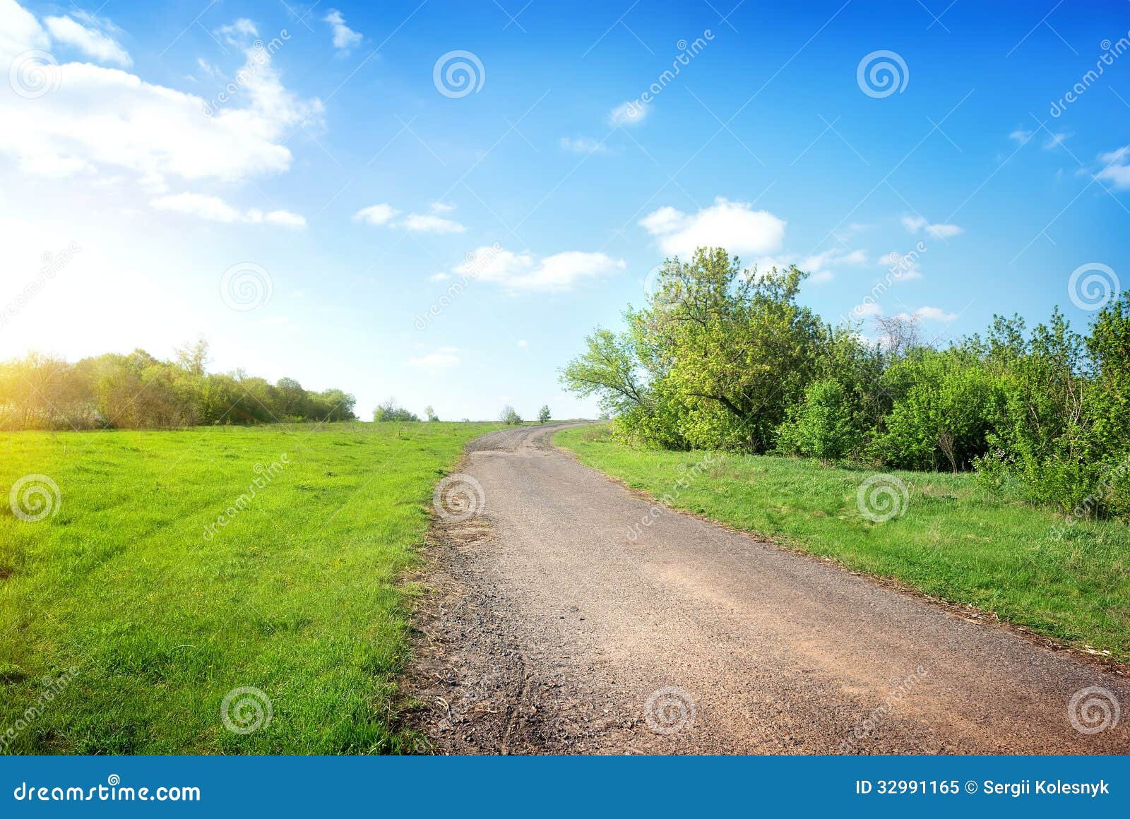 Wide road in the field stock image. Image of blue, grass - 32991165