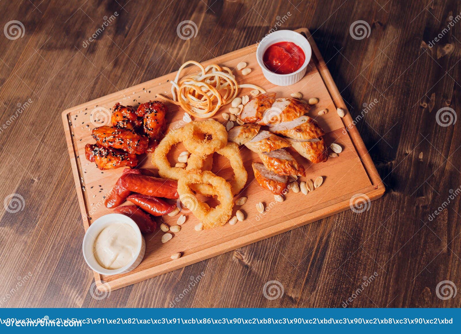 Wide Selection of Snacks for Beer with Different Sauces on Parchment ...