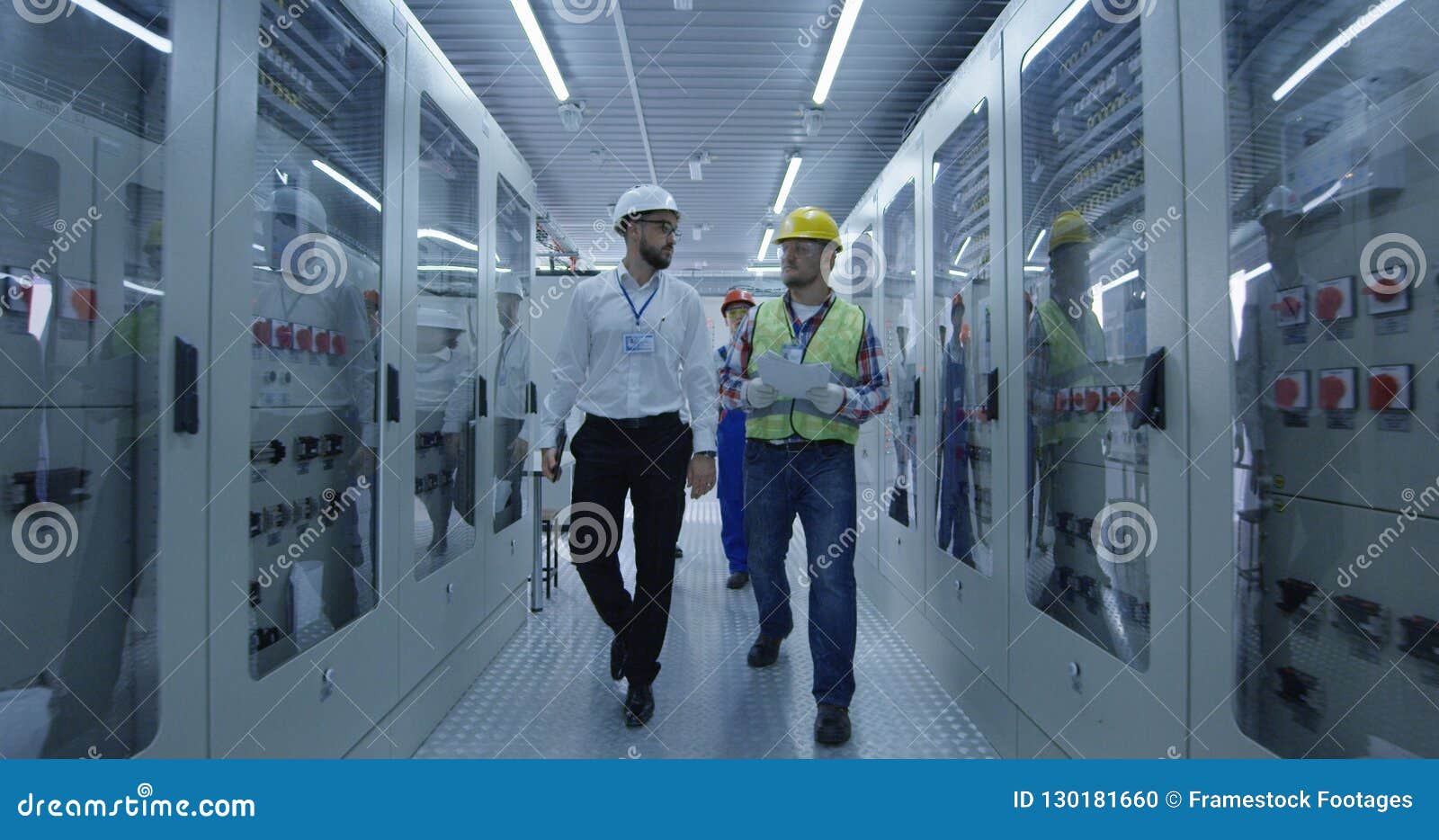 Electrical Workers Walking in the Control Room Stock Photo - Image of ...