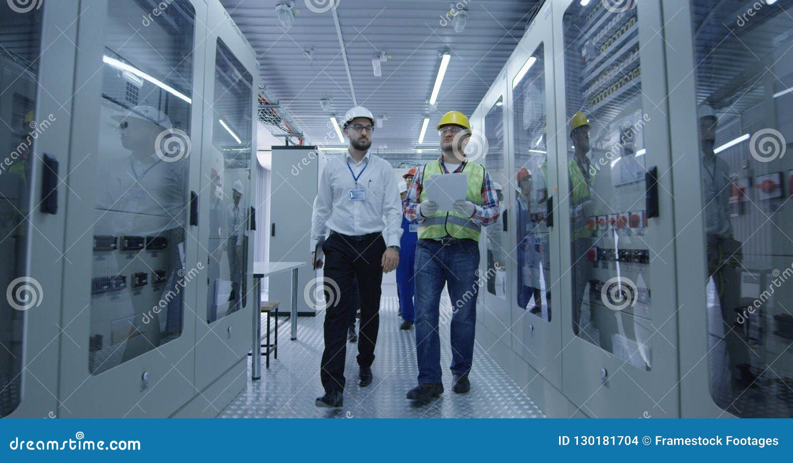 Electrical Workers Walking in the Control Room Stock Photo - Image of ...