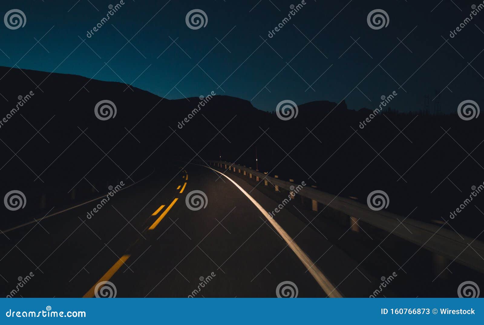 Wide Shot of an Empty Road at Night Time Under the Dark Sky Stock Image ...