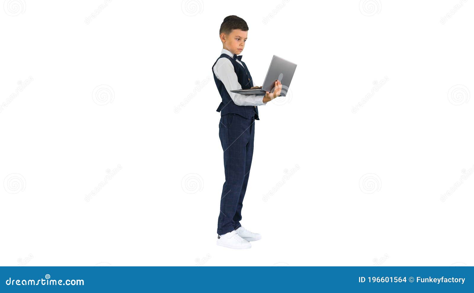 Concentrated Boy in a Bow Tie and Waistcoat Using Laptop Compute Stock ...