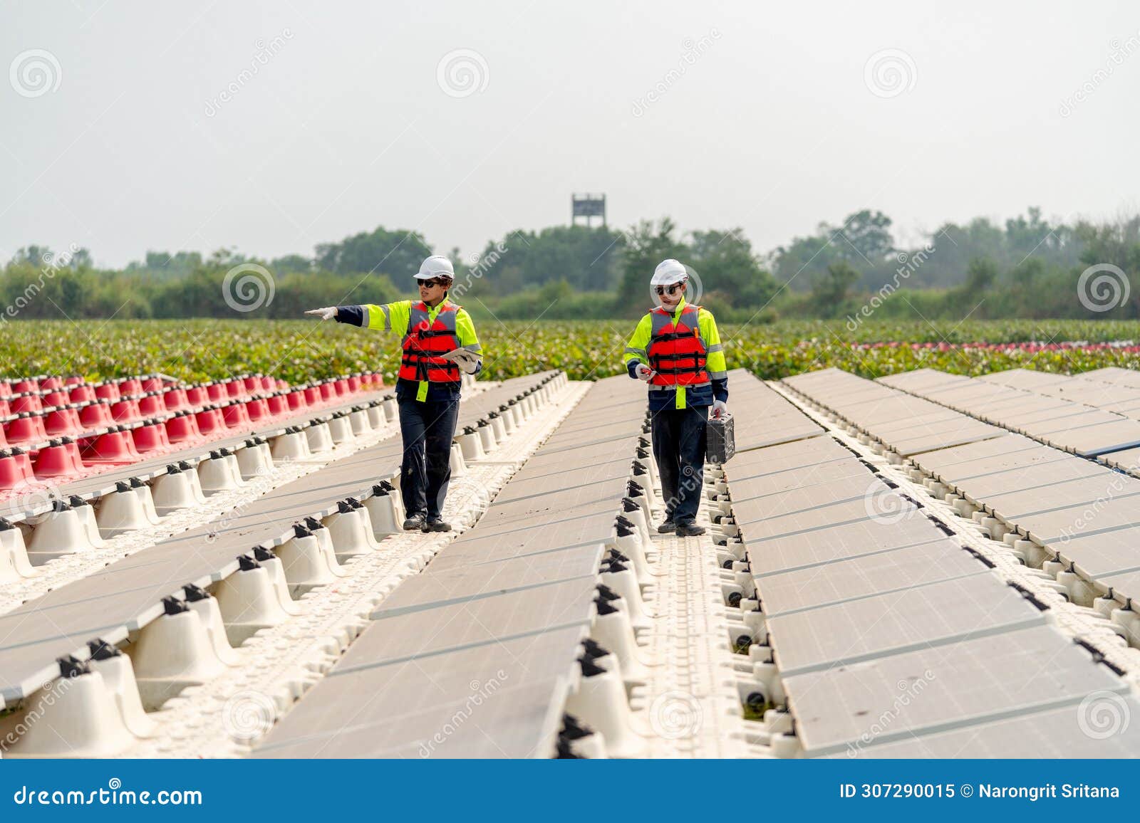 Wide Shot of Two Professional Workers Walk Along Footpath in Area of ...
