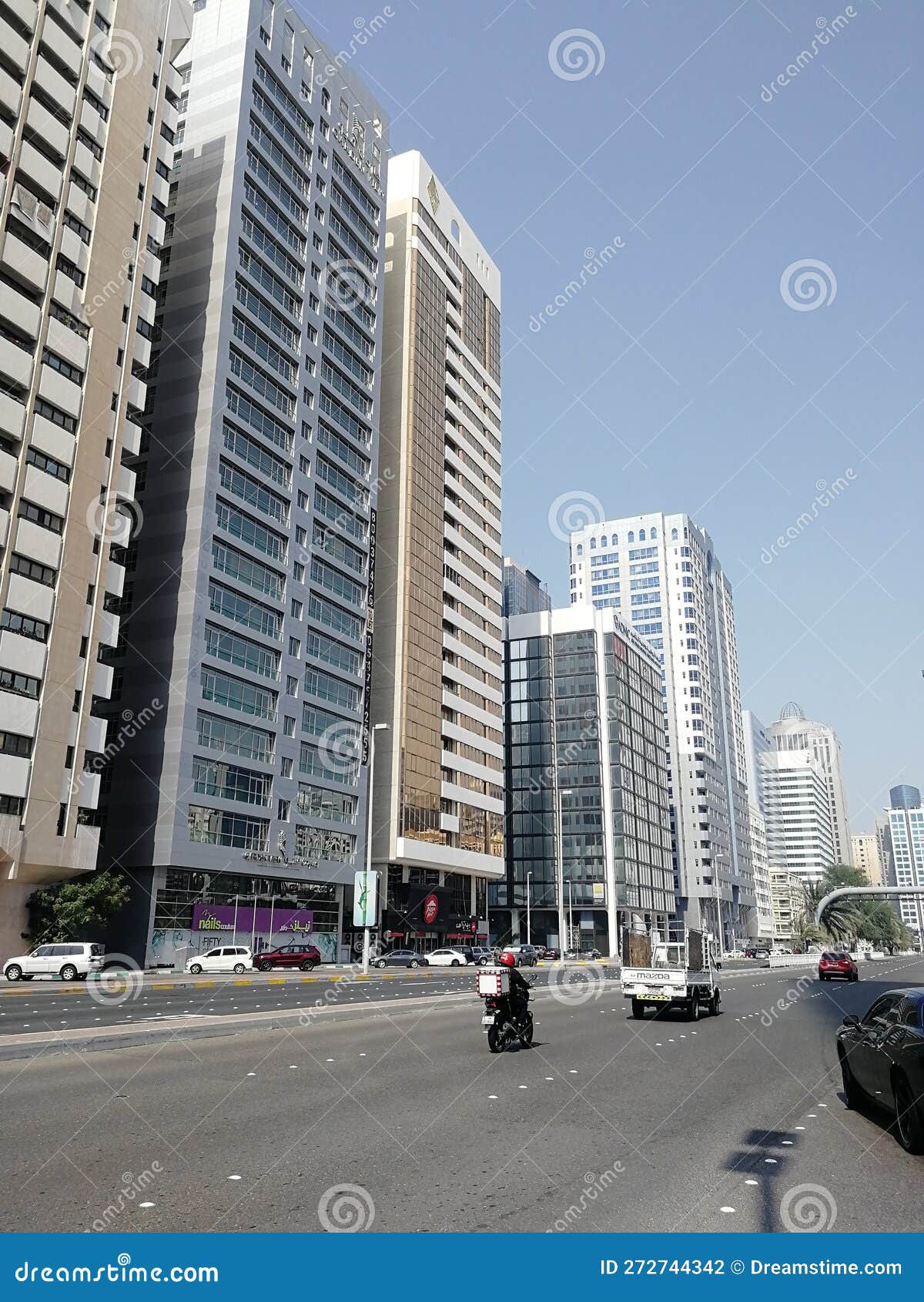 Wide street in abu dhabi stock photo. Image of building - 272744342