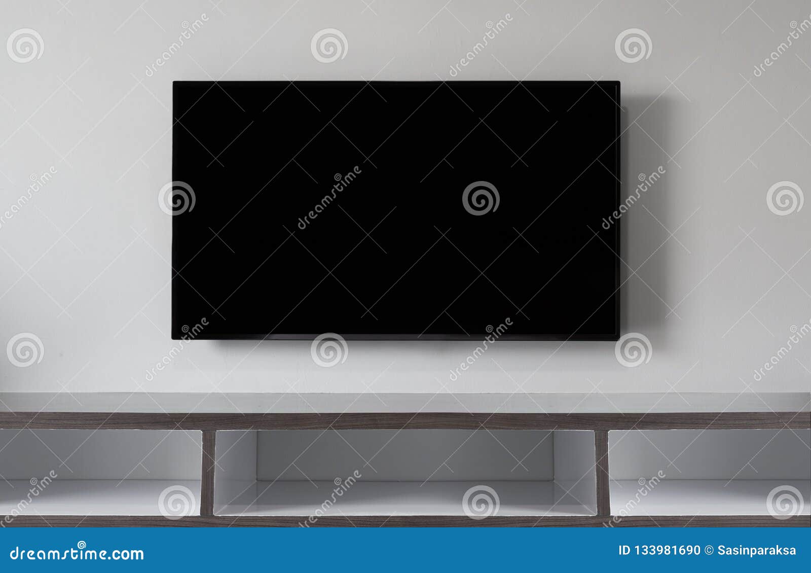 Widescreen Television on White Wall Stock Photo - Image of screen ...